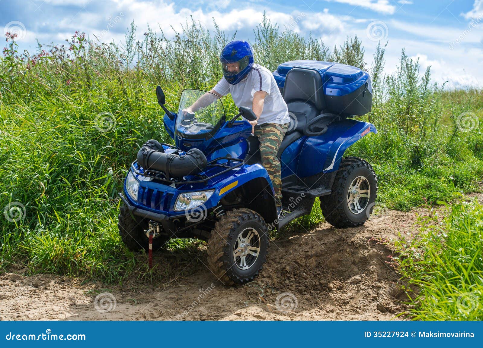 Man on quad stock photo. Image of nature, helmet, active - 35227924