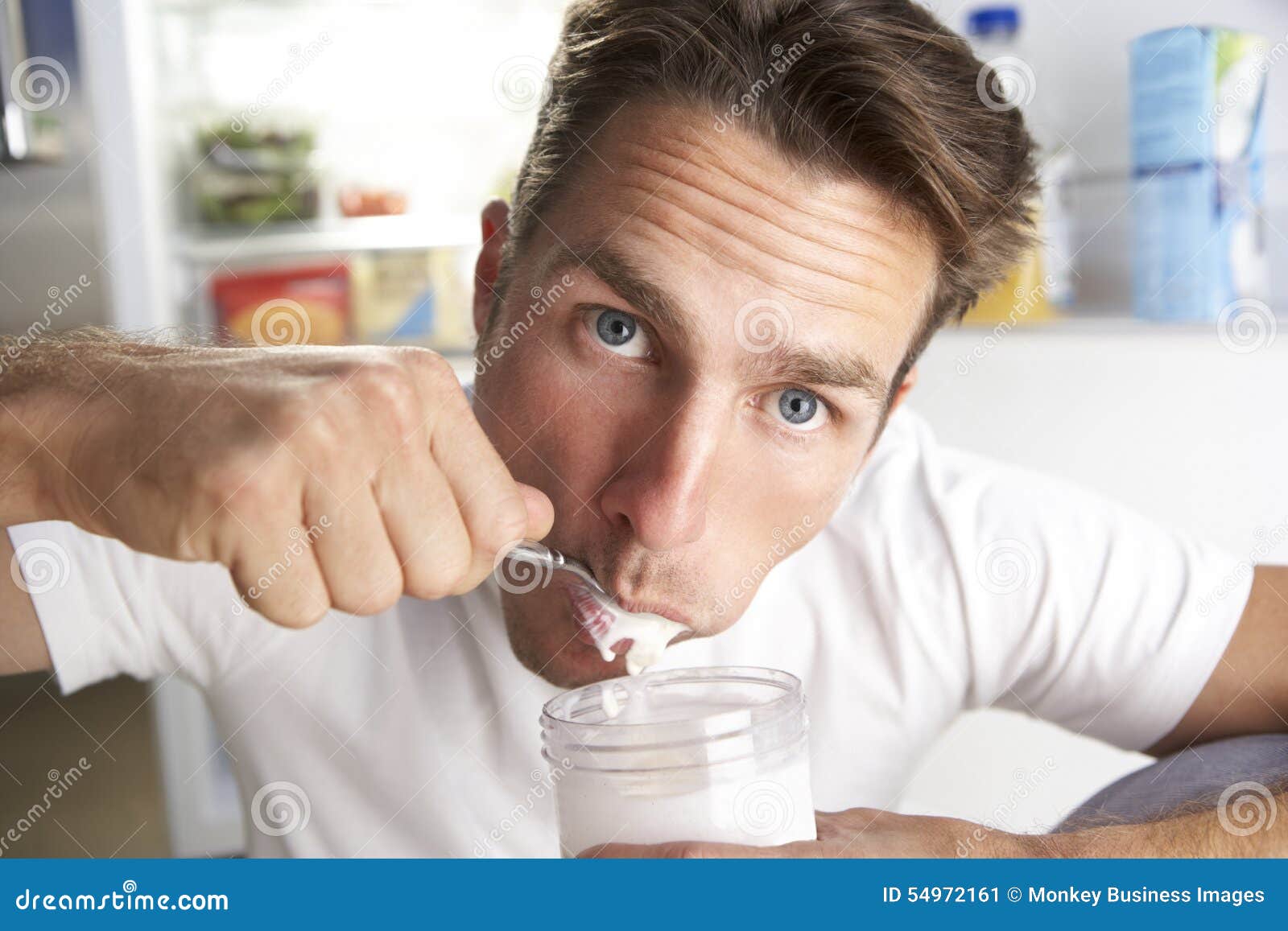 Man Raiding the Fridge at Night Stock Image - Image of eating, kitchen ...