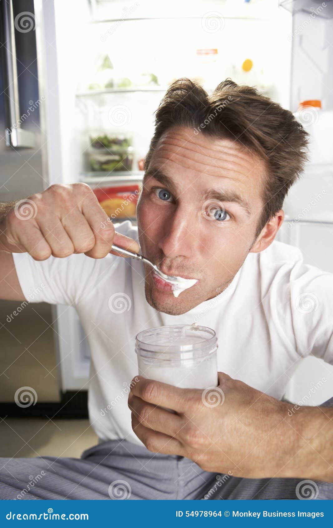 Man Raiding the Fridge at Night Stock Photo - Image of enjoyment ...