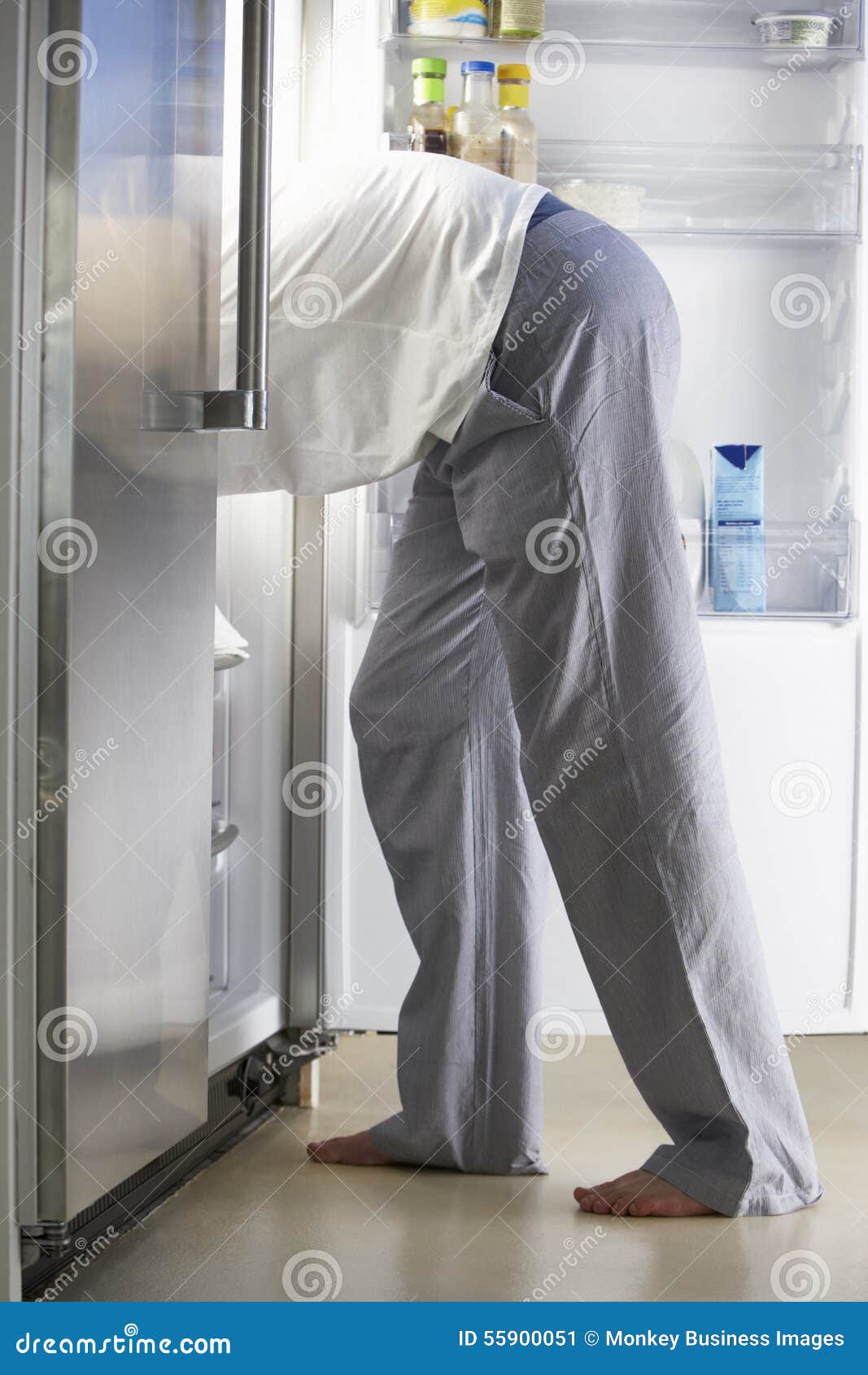 Man Raiding the Fridge at Night Stock Image - Image of people, indoors ...