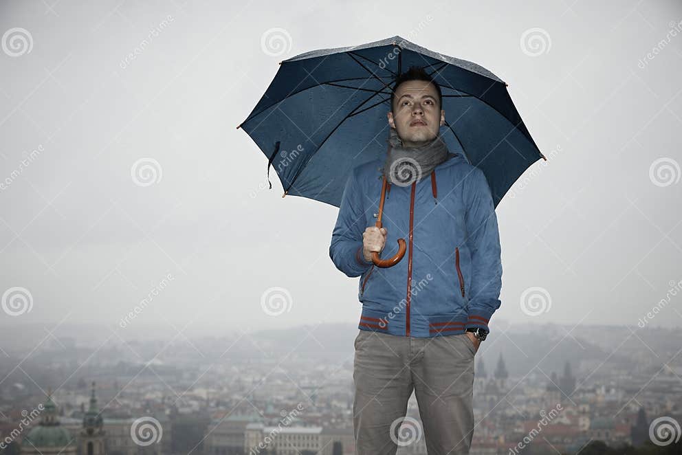 Man in rain stock image. Image of city, overcast, blue - 27075935
