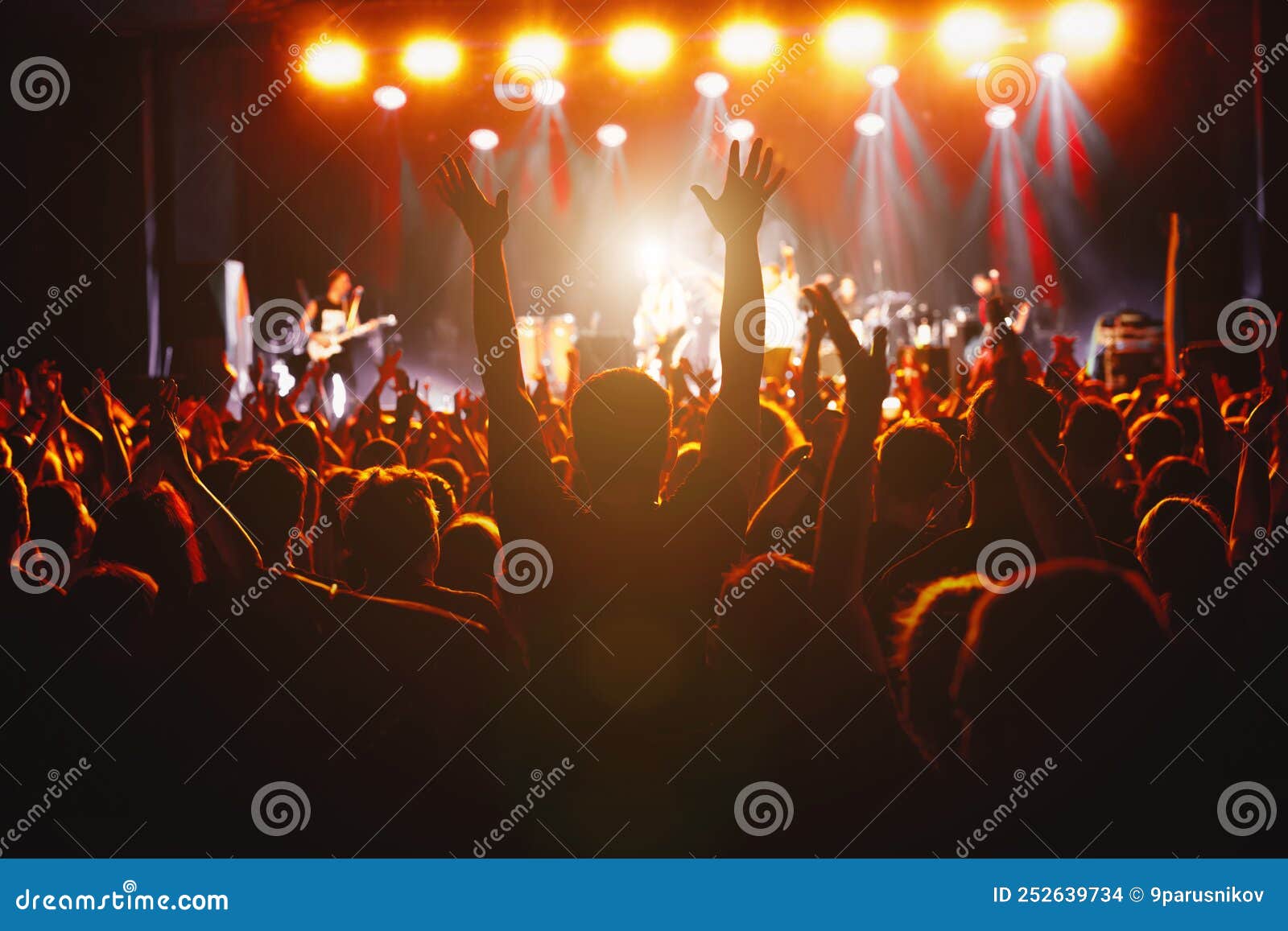 The Man with Raised Hands during the Music Concert. Crowd and Stage ...