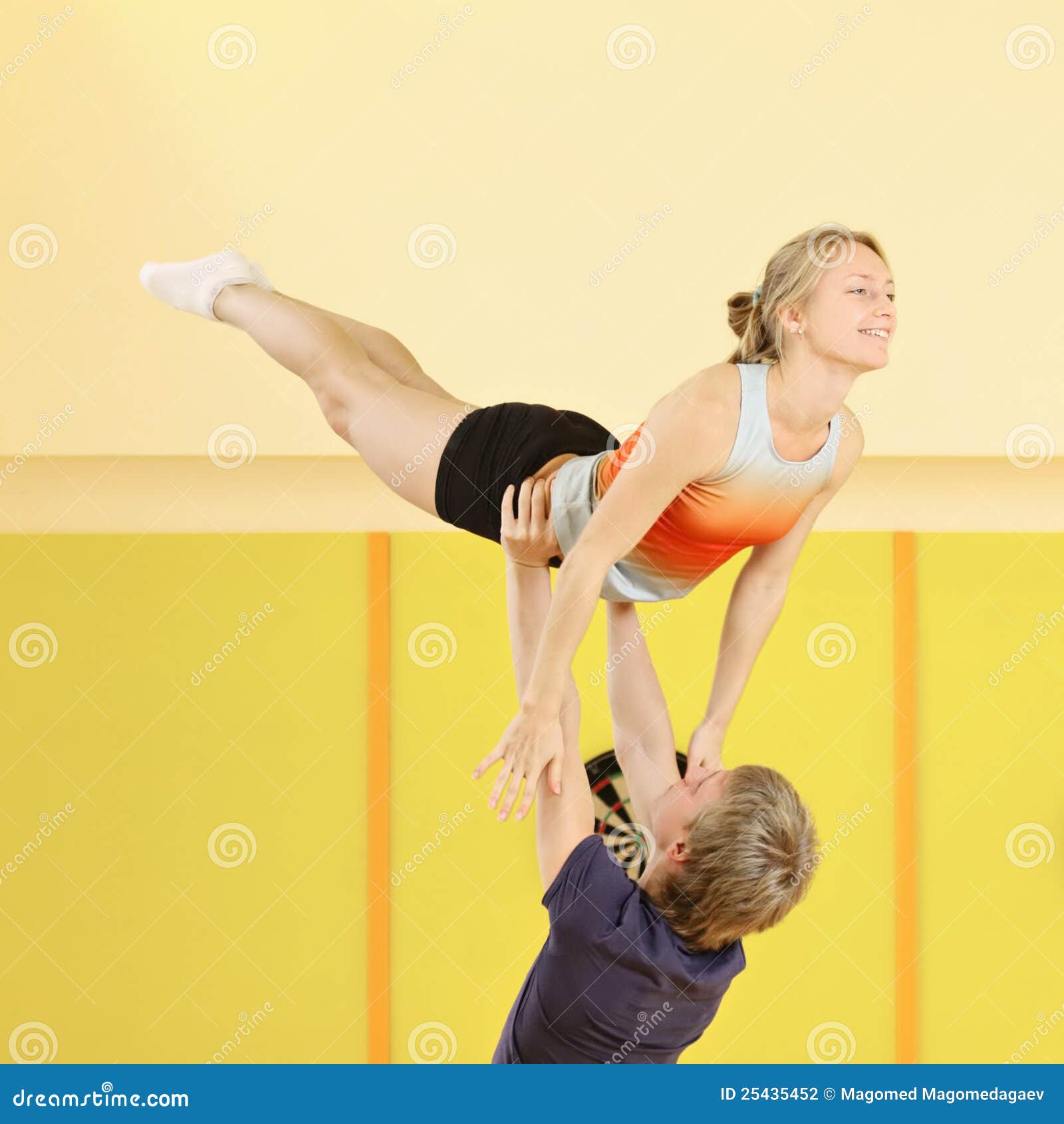 Man raising woman on hands stock photo. Image of raising - 25435452