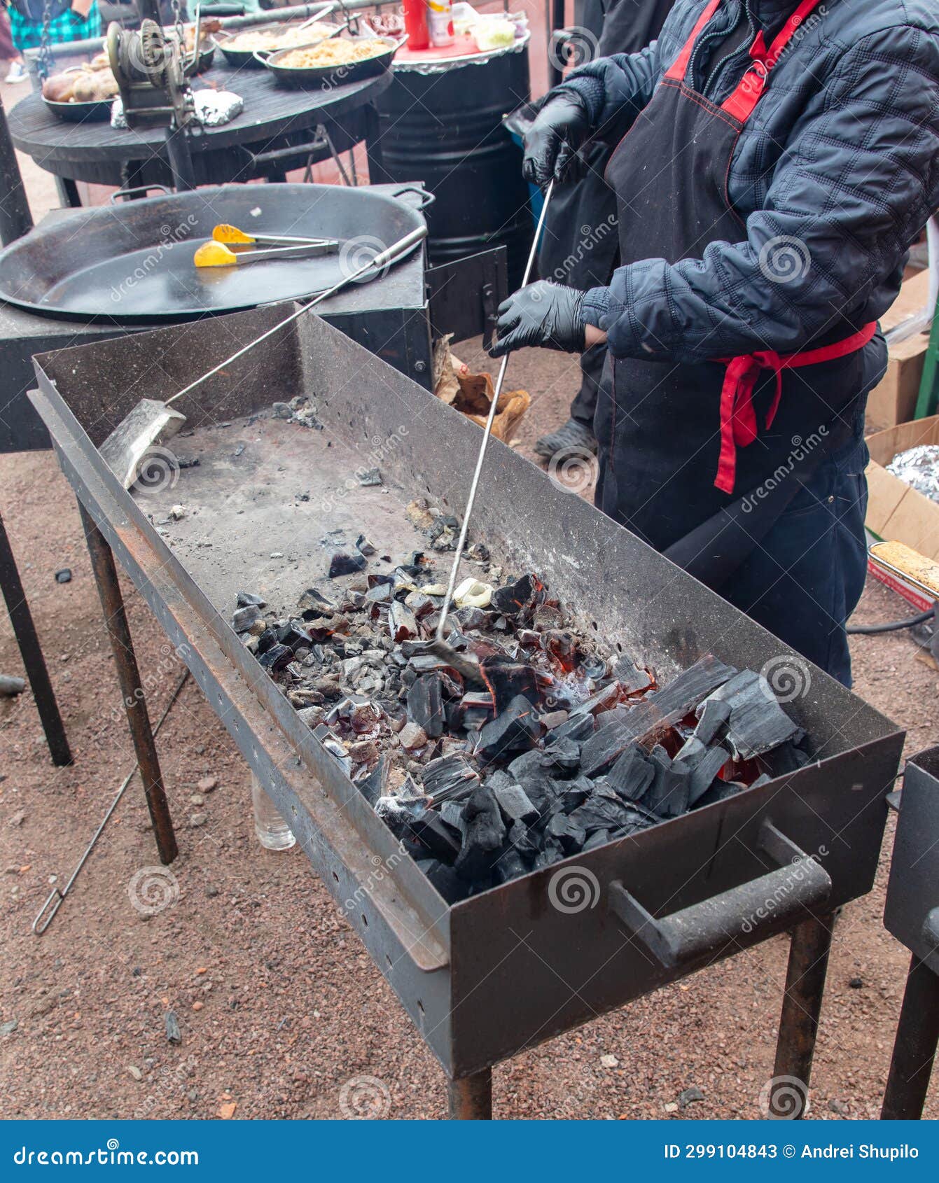A Man Rakes Coals in a Barbecue Stock Image - Image of barbecue, heat ...