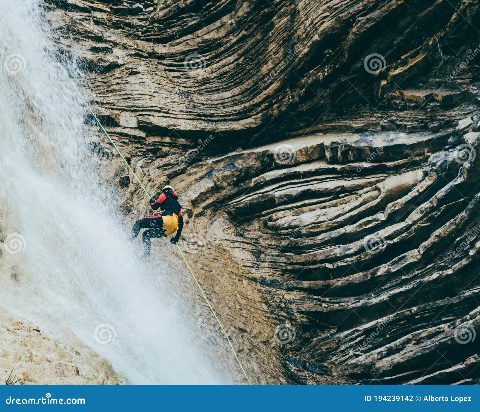 Man Rappelling Down a Waterfall Stock Photo - Image of nature, helmet ...