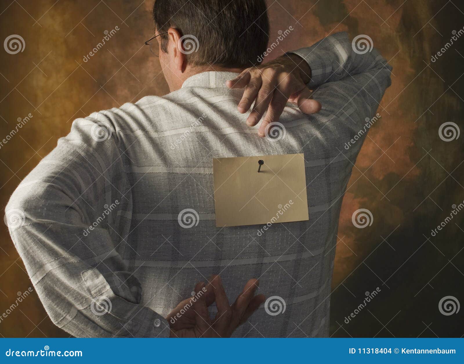 Man Reaching for Communication or Note on Back Stock Photo - Image of ...
