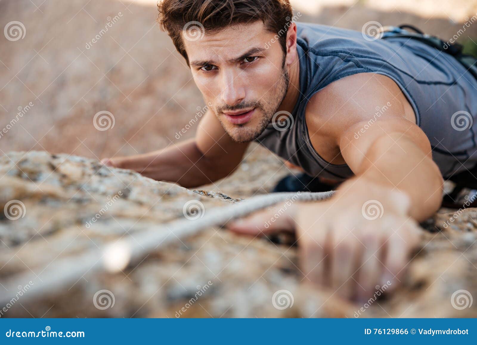 Man Reaching For A Grip While He Rock Climbs Royalty-Free Stock Image ...