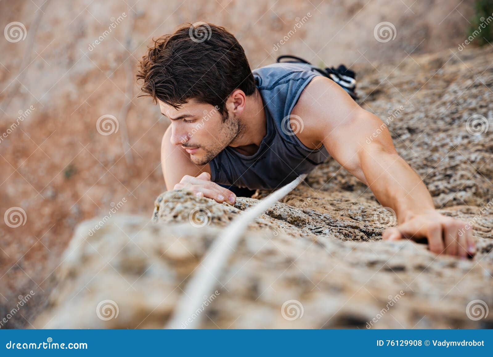 Man Reaching For A Grip While He Rock Climbs Royalty-Free Stock Image ...