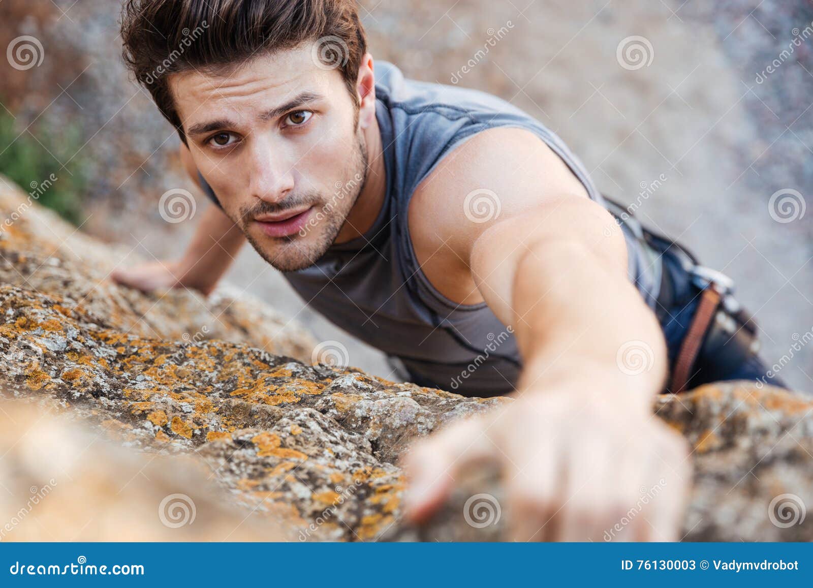Man Reaching For A Grip While He Rock Climbs Royalty-Free Stock Image ...