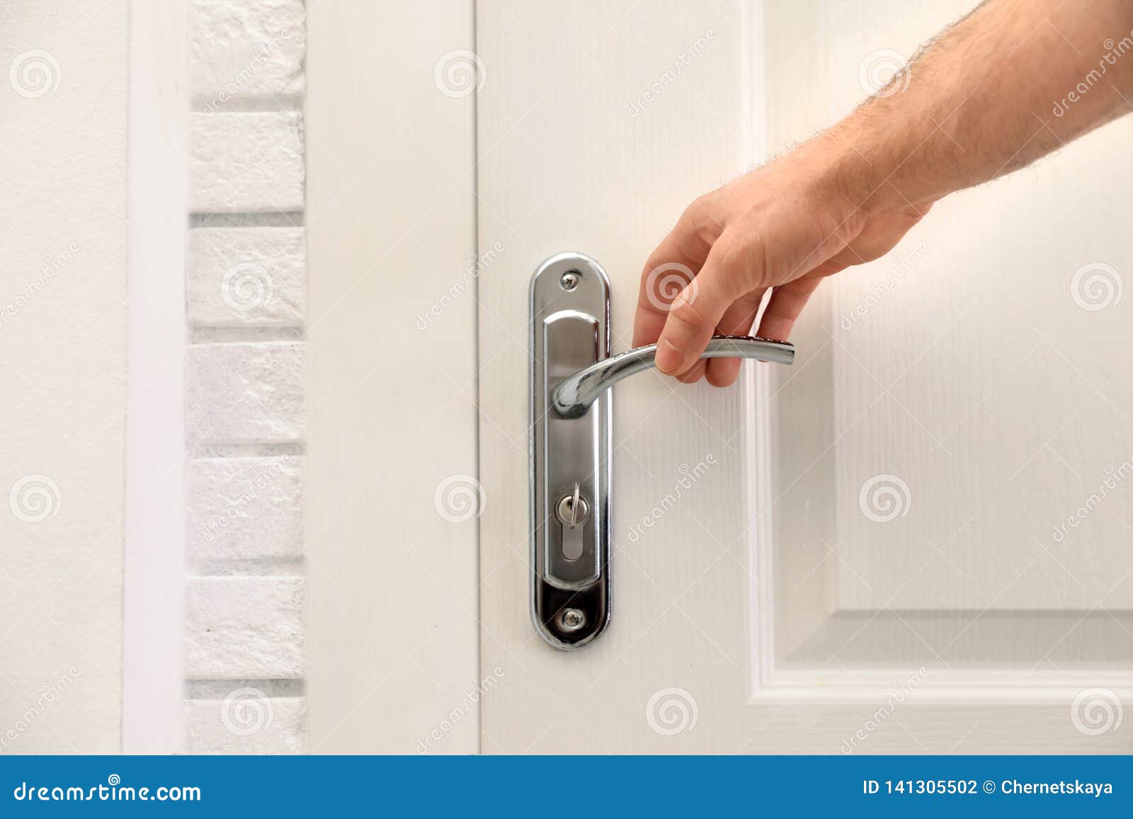 Man Reaching To Metal Door Handle Stock Photo - Image of estate, entry ...
