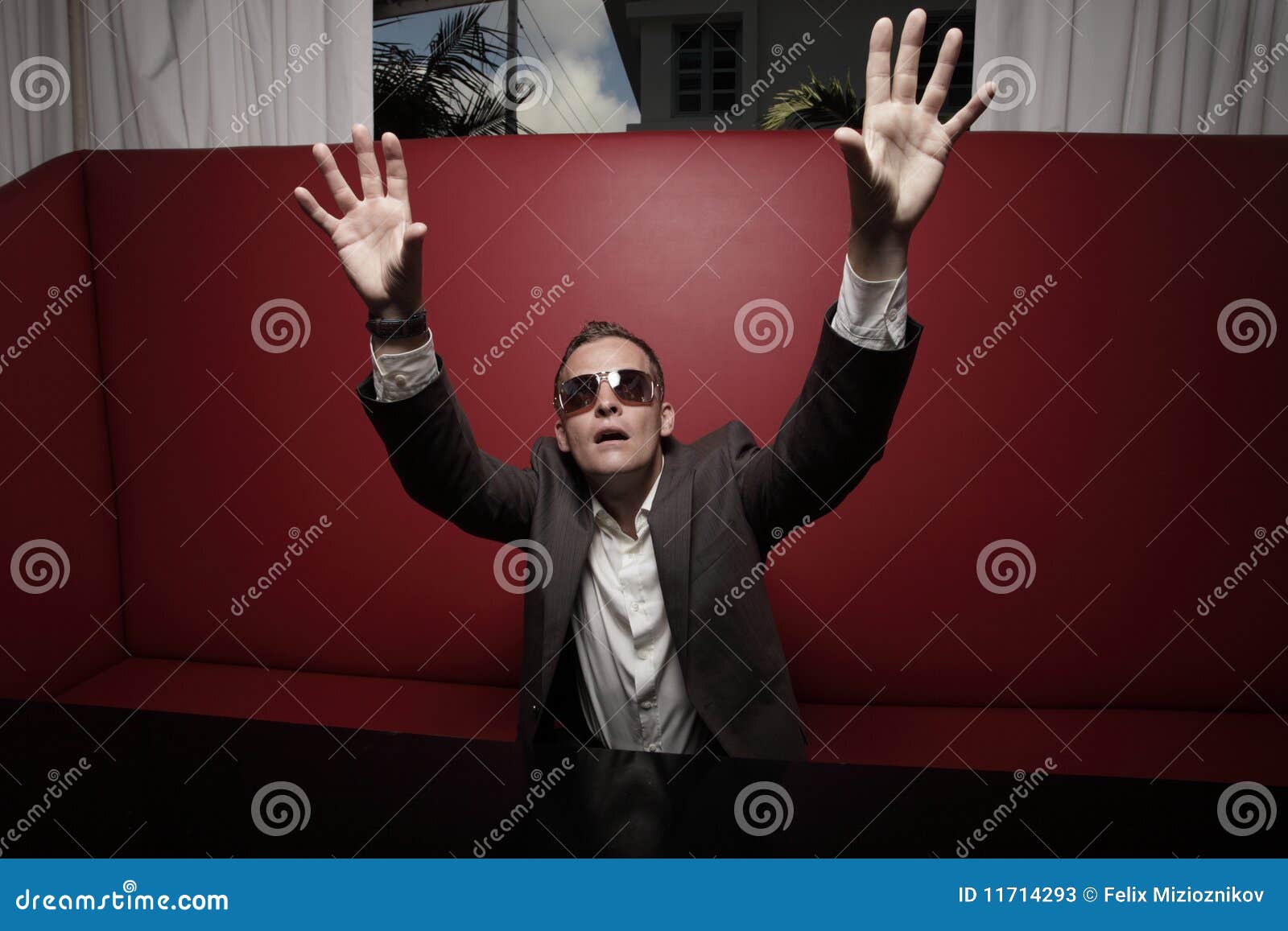 Man reaching upward stock image. Image of sitting, young - 11714293