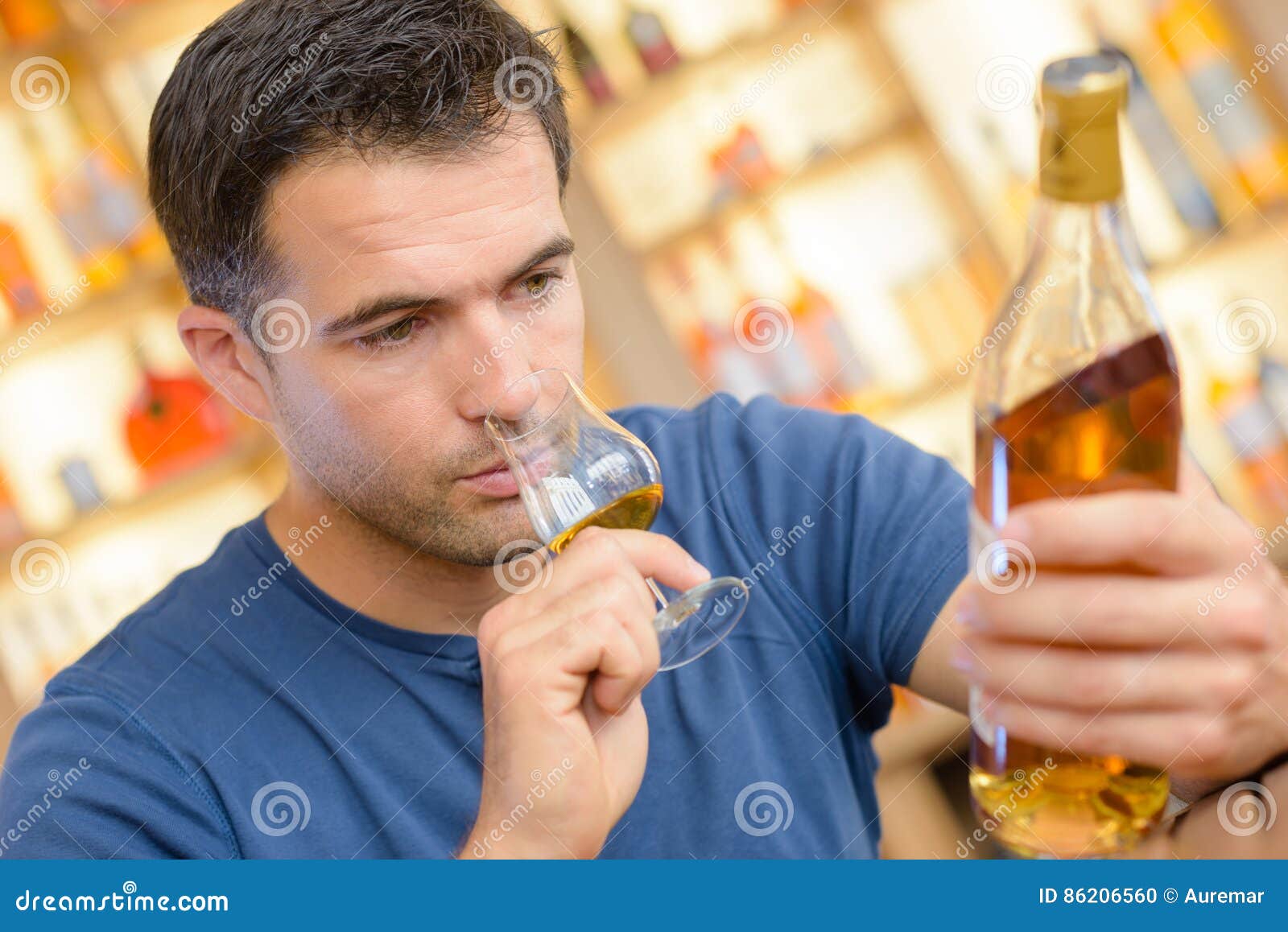 Man reading alcohol label stock photo. Image of shopper - 86206560