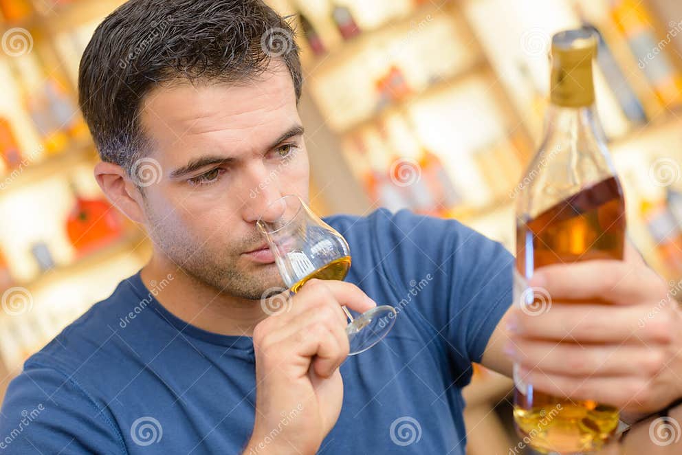 Man reading alcohol label stock photo. Image of shopper - 86206560