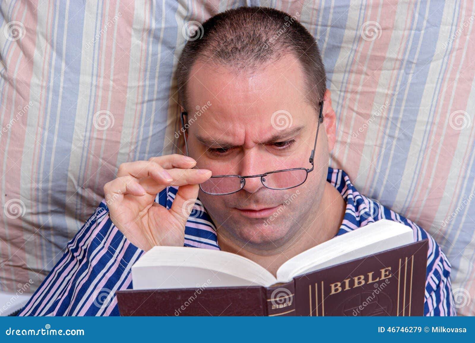 Man reading the Bible stock image. Image of pajamas, adult - 46746279