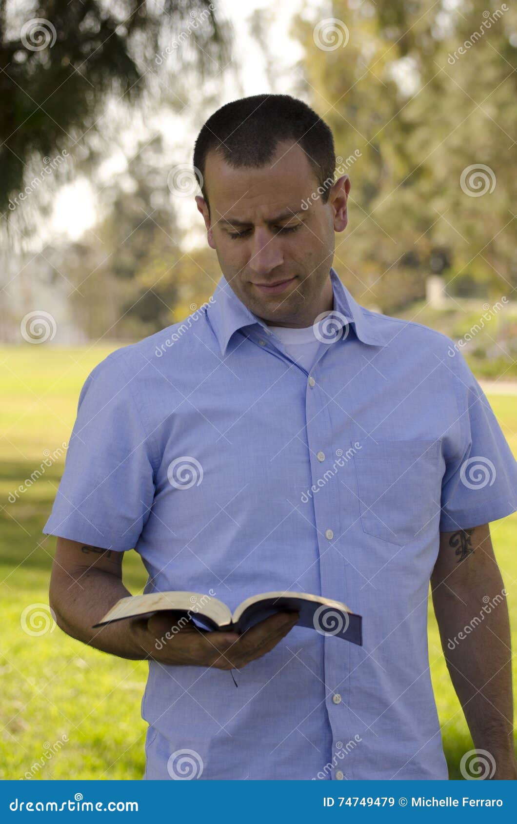 Man reading bible stock image. Image of outside, nature - 74749479