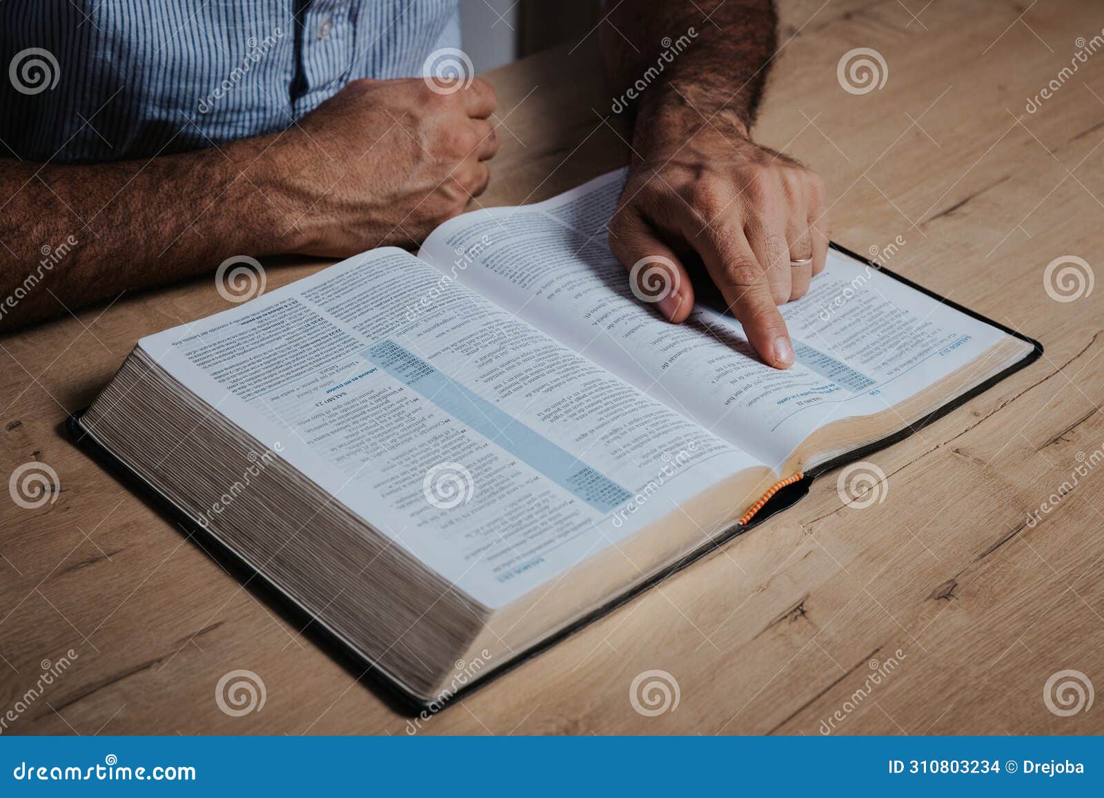 Man is Reading the Bible Pointing with His Finger at the Text Stock ...