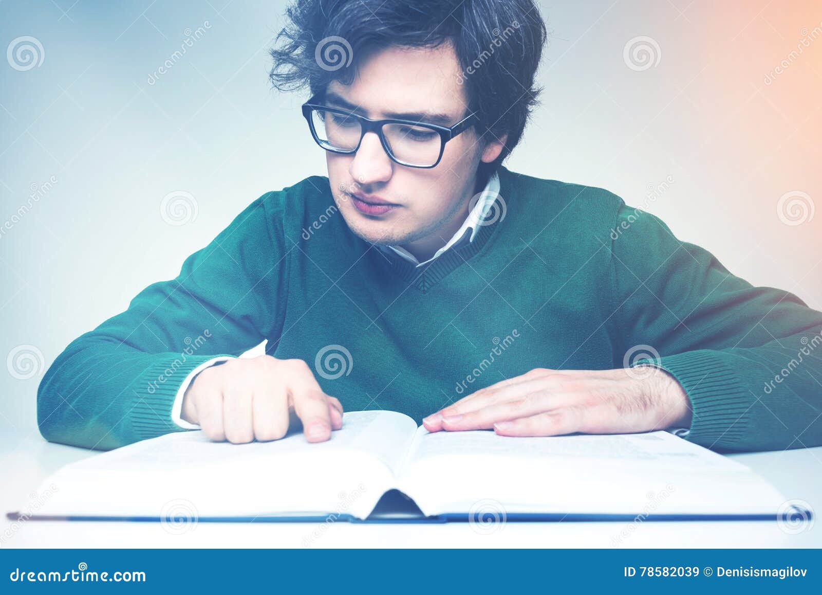 Man reading a big book stock image. Image of male, brunet - 78582039