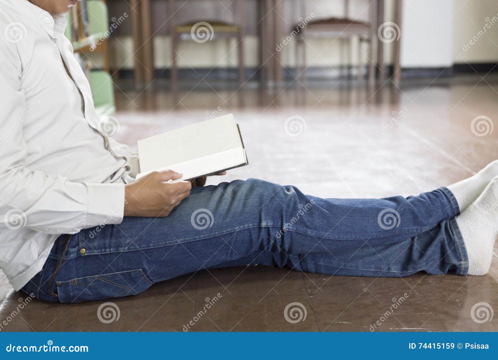 Man Reading Book in Aisle in Library Stock Image - Image of studying ...
