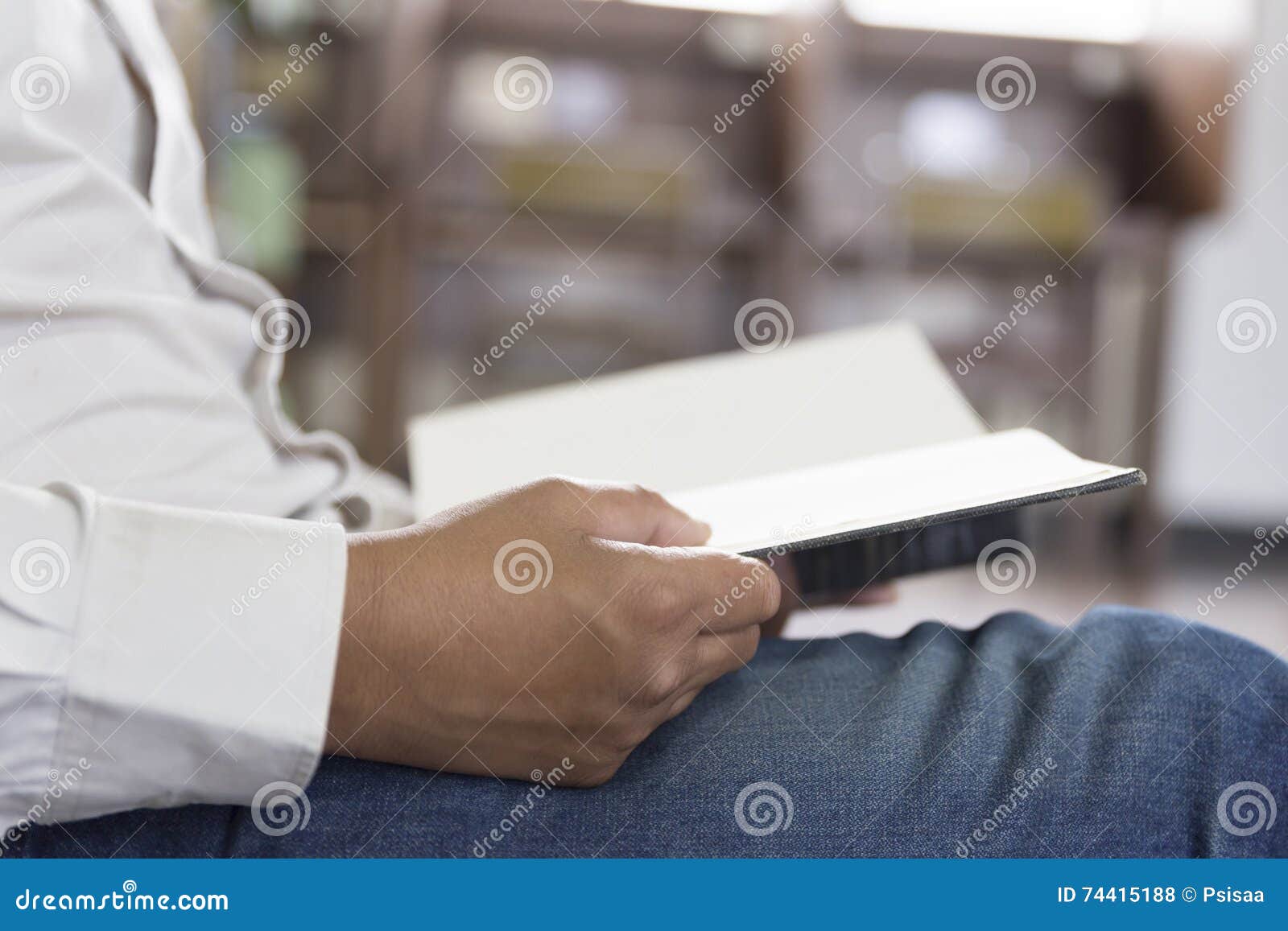 Man Reading Book in Aisle in Library Stock Photo - Image of reading ...