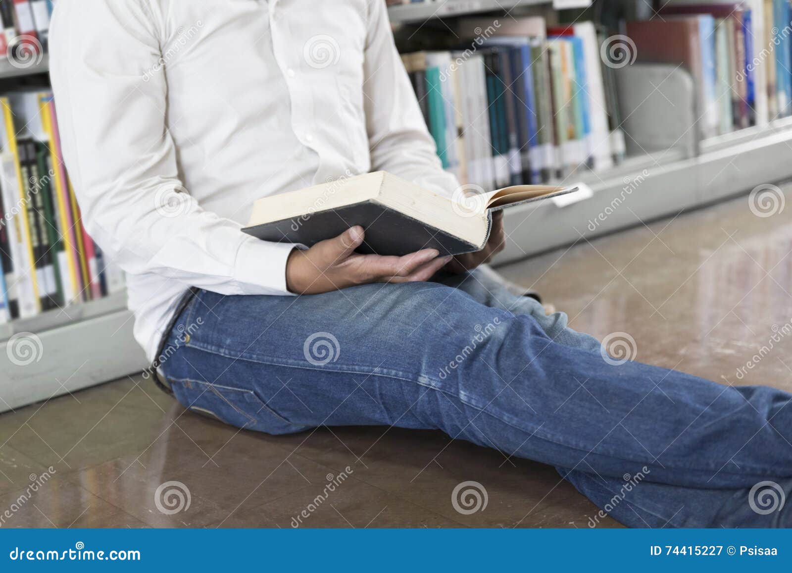 Man Reading Book in Aisle in Library Stock Image - Image of portrait ...