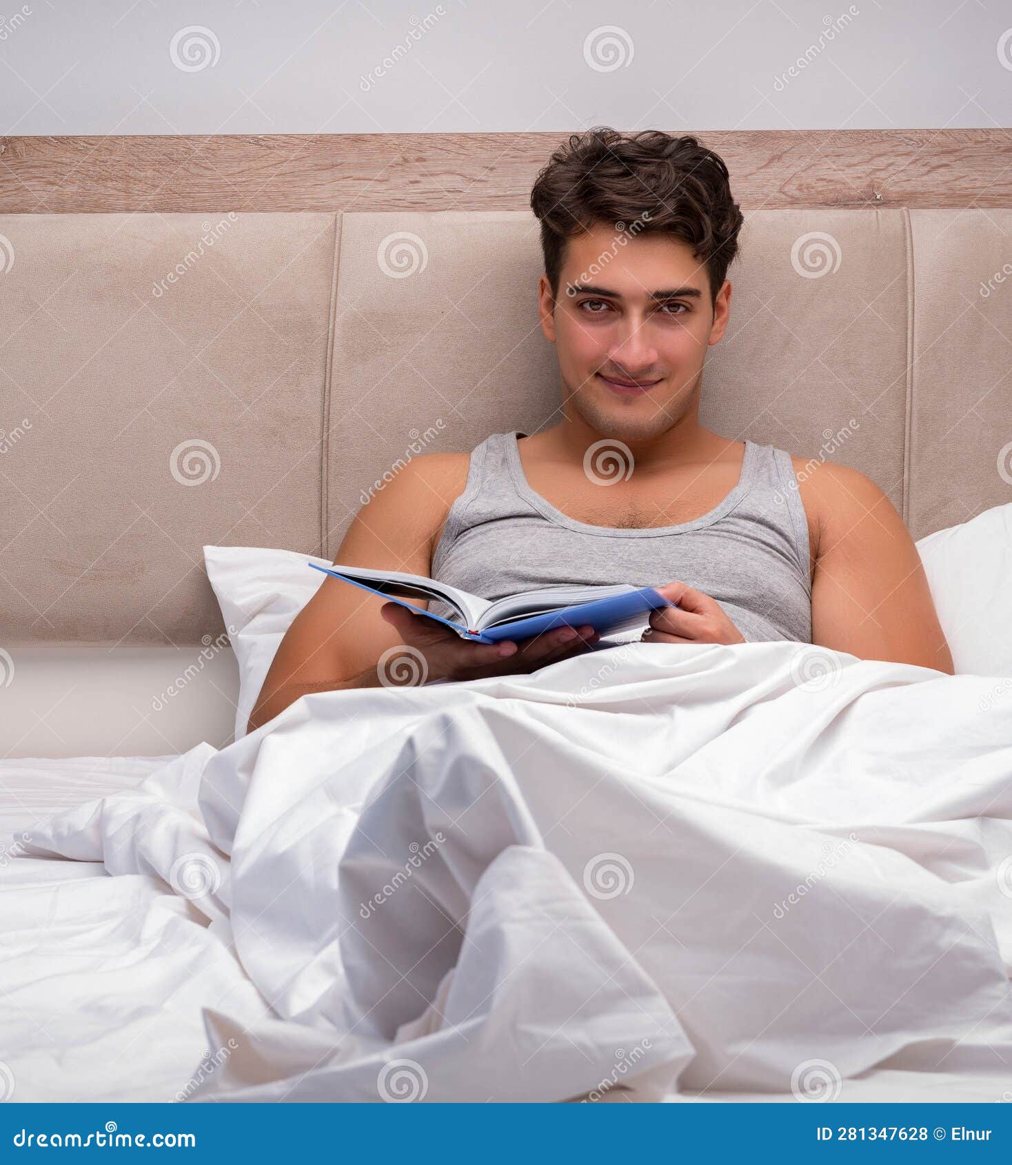 Man Reading Book in the Bed Stock Photo - Image of awake, morning ...