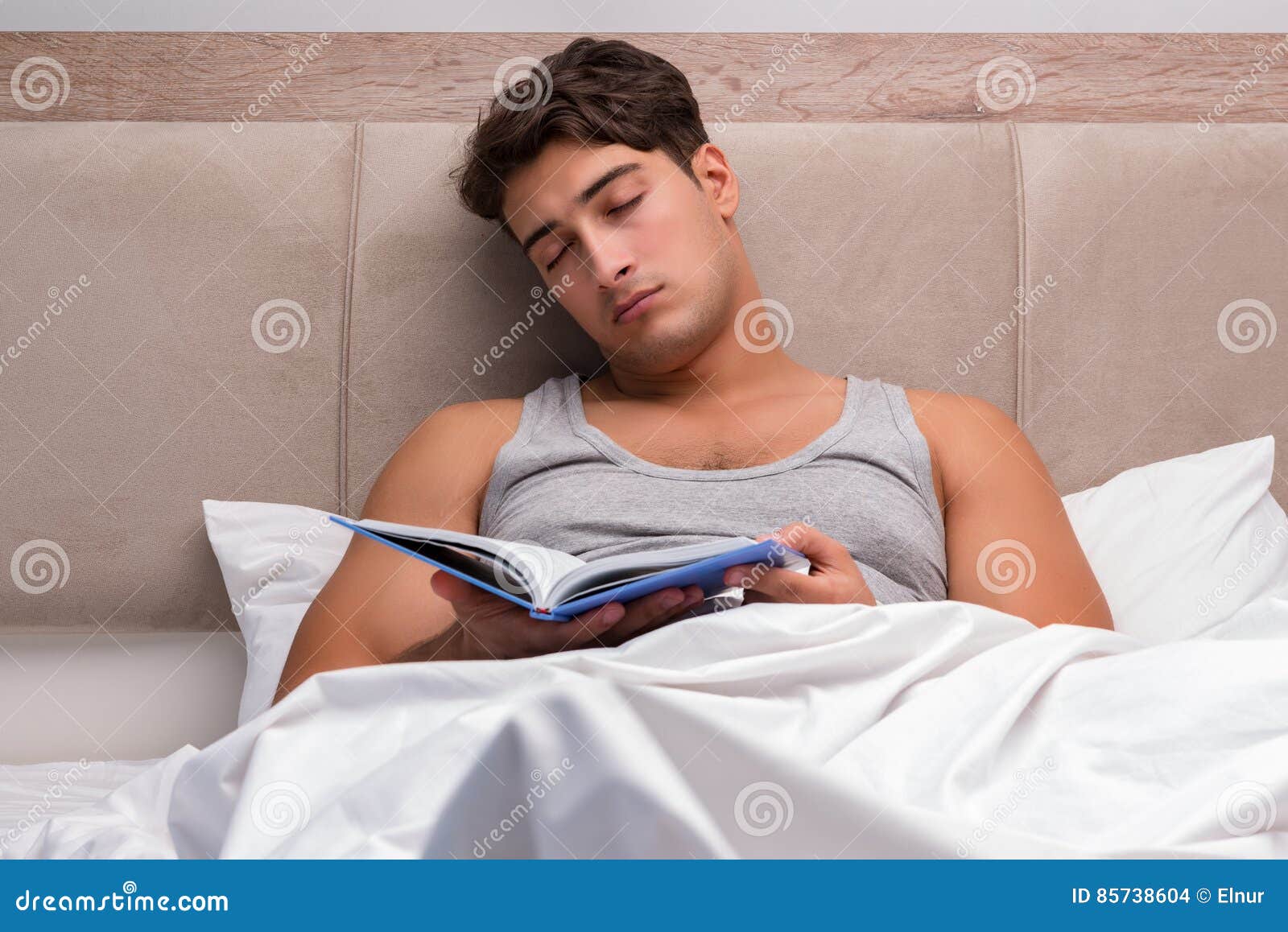 The Man Reading Book in the Bed Stock Photo - Image of lying, indoor ...