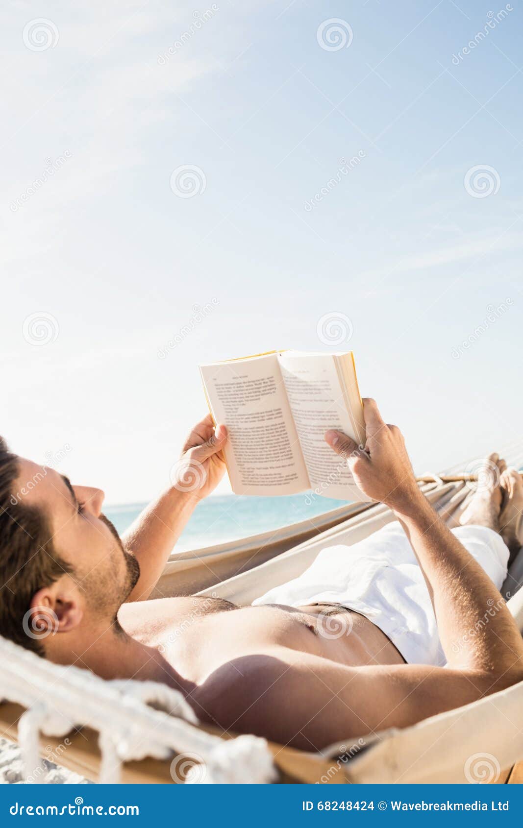 Man Reading Book in Hammock Stock Photo - Image of beach, hammock: 68248424