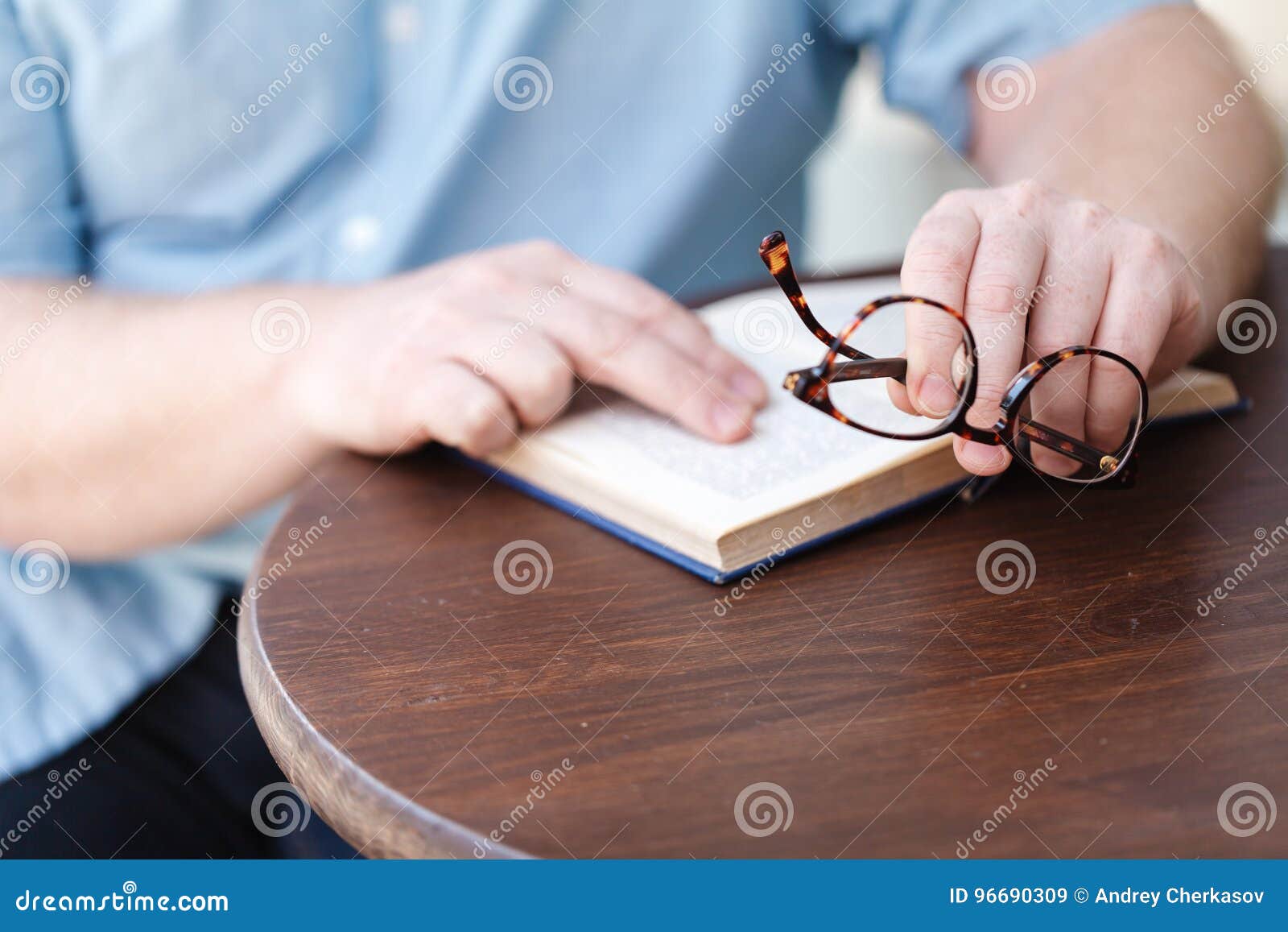 Man Reading. Book in His Hands Stock Image - Image of page, open: 96690309