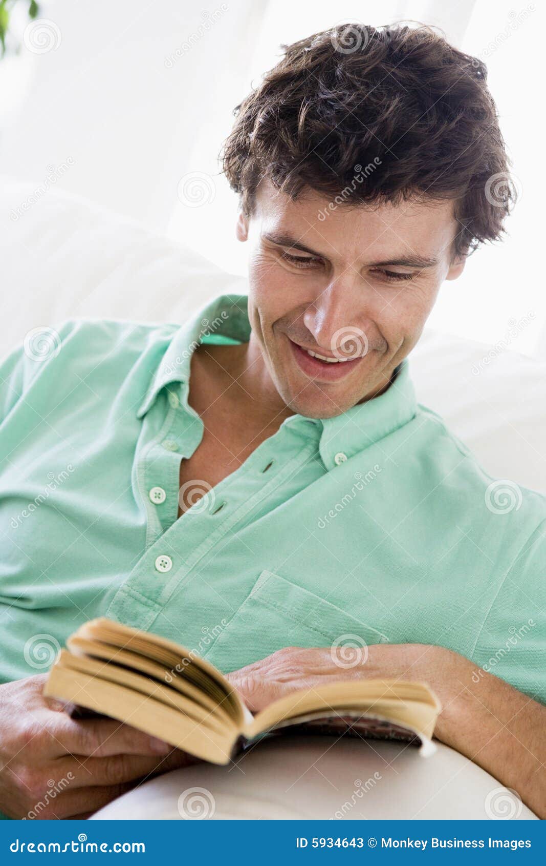 Man Reading Book in Living Room Smiling Stock Image - Image of relaxing ...