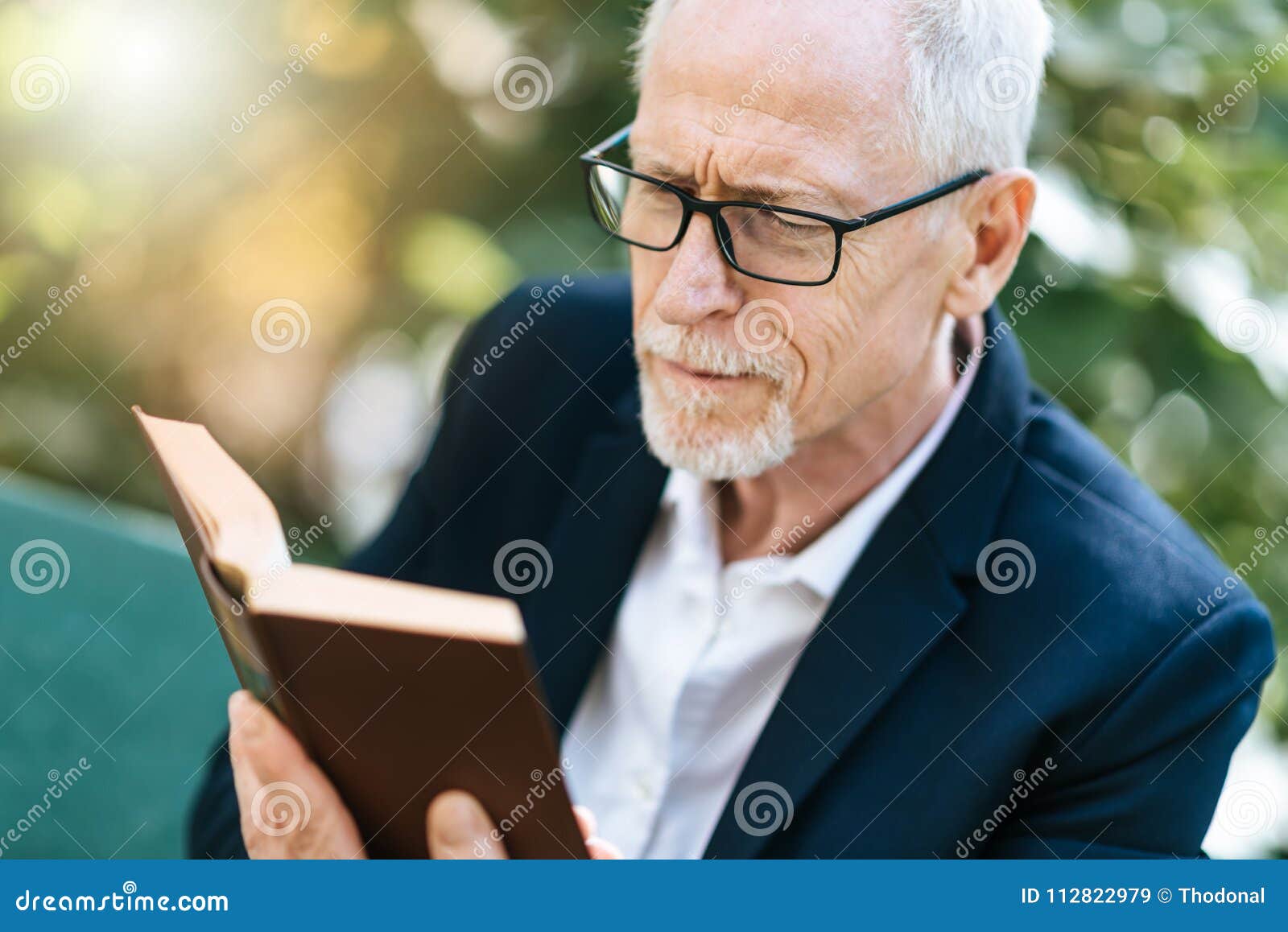 Man Reading a Book Outdoors, Light Effect Stock Image - Image of casual ...