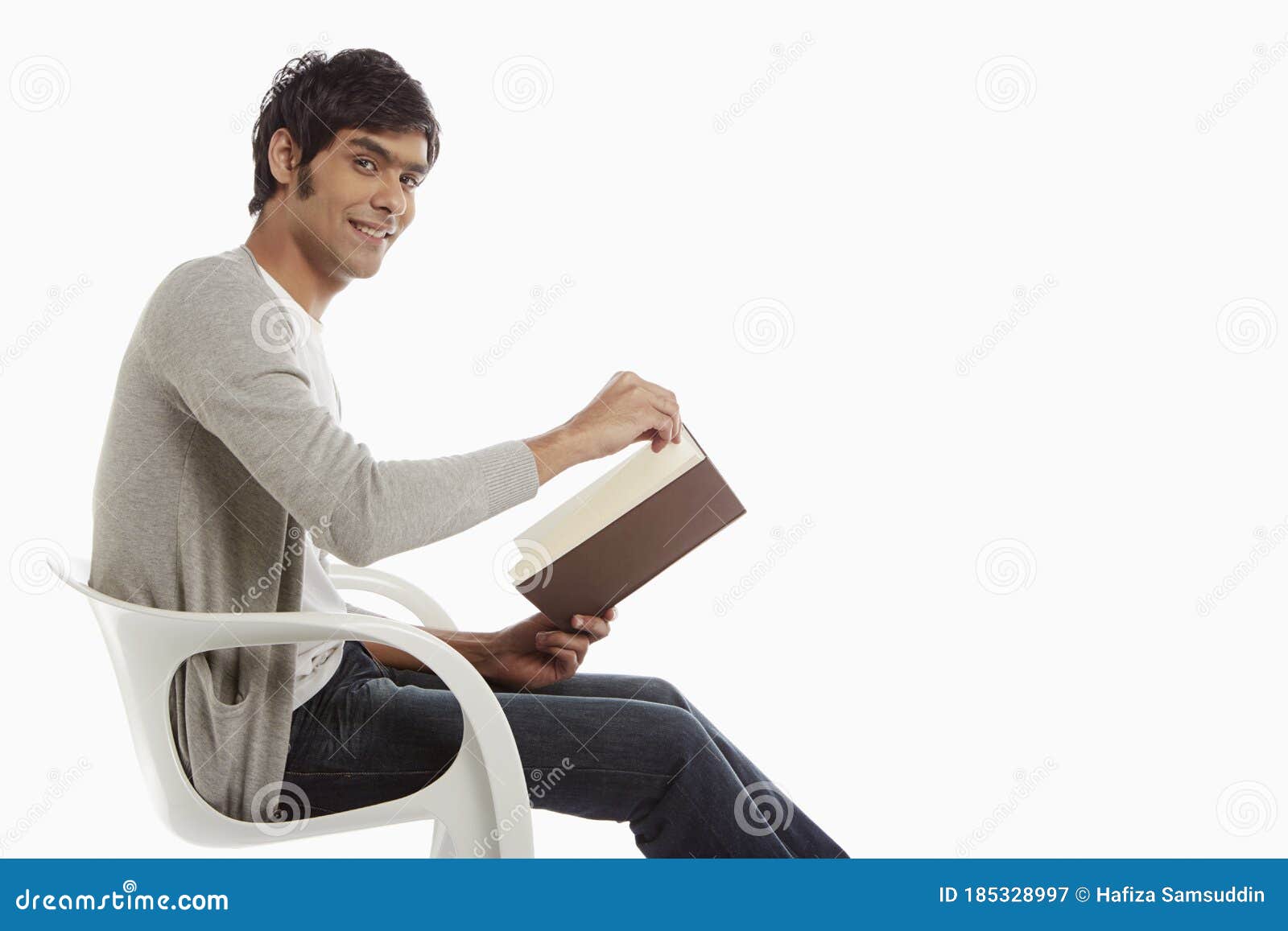 Man Reading a Book while Sitting Stock Image - Image of masculine ... Man Reading a Book while Sitting Stock Image - Image of masculine ...