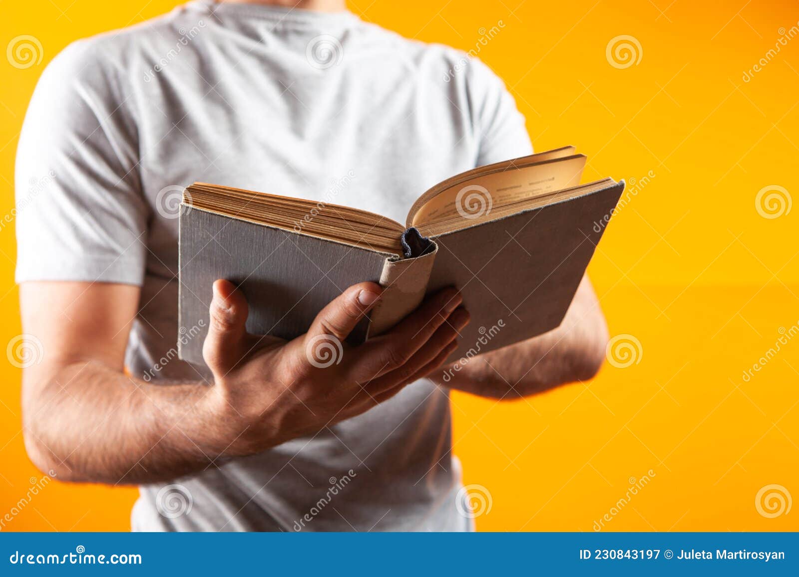 Man Reading a Book while Standing Stock Image - Image of standing ...