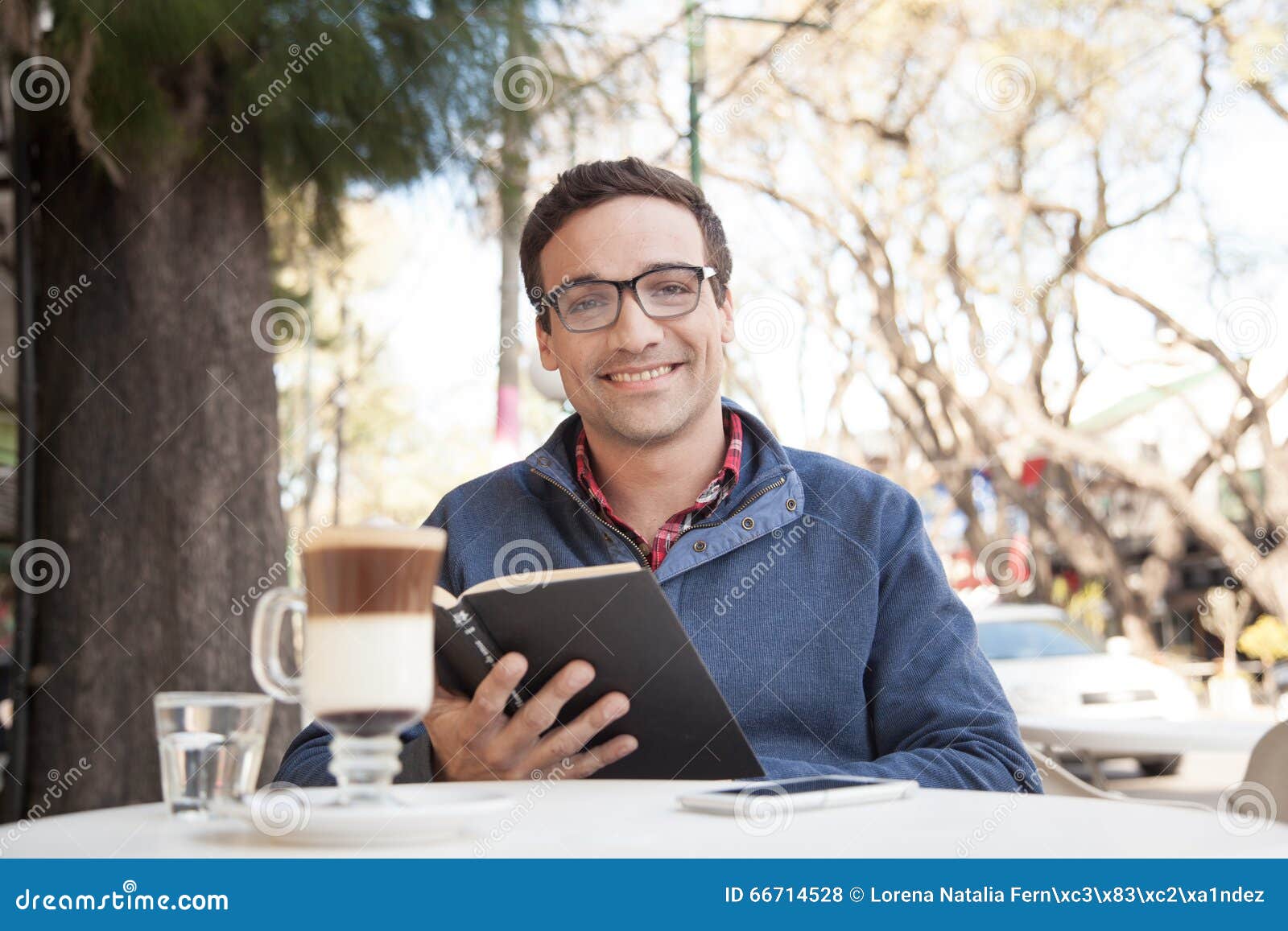 Man Reading a Book in the Street Stock Photo - Image of modern ...