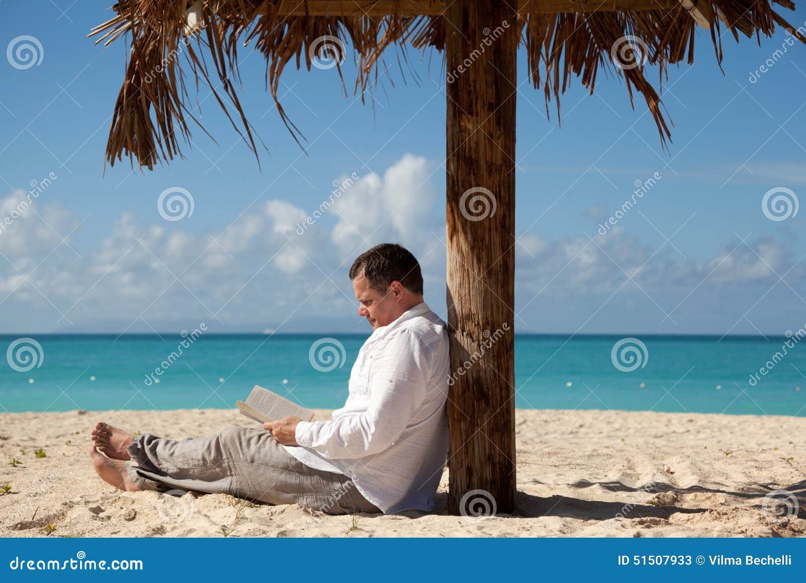 Man reading a book stock image. Image of lagoon, resort - 51507933