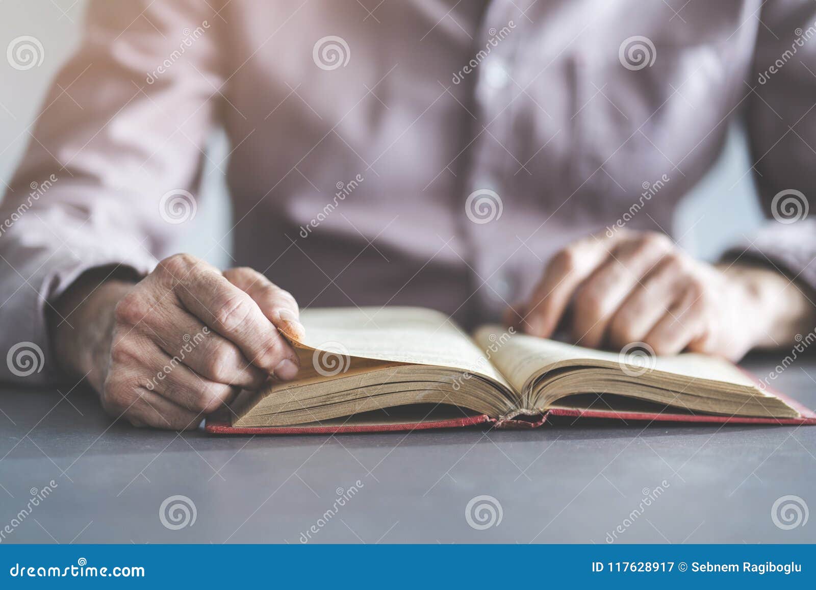Man Reading Book on the Table Stock Image - Image of adult, desk: 117628917