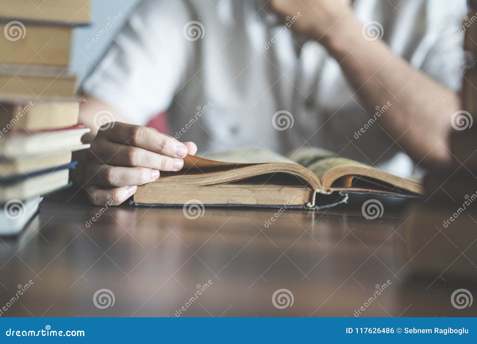 Man Reading Book on the Table Stock Photo - Image of novel, male: 117626486