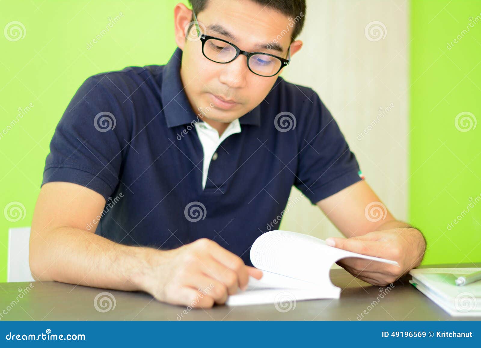 A Man Reading Book on the Table Stock Image - Image of studious, person ...