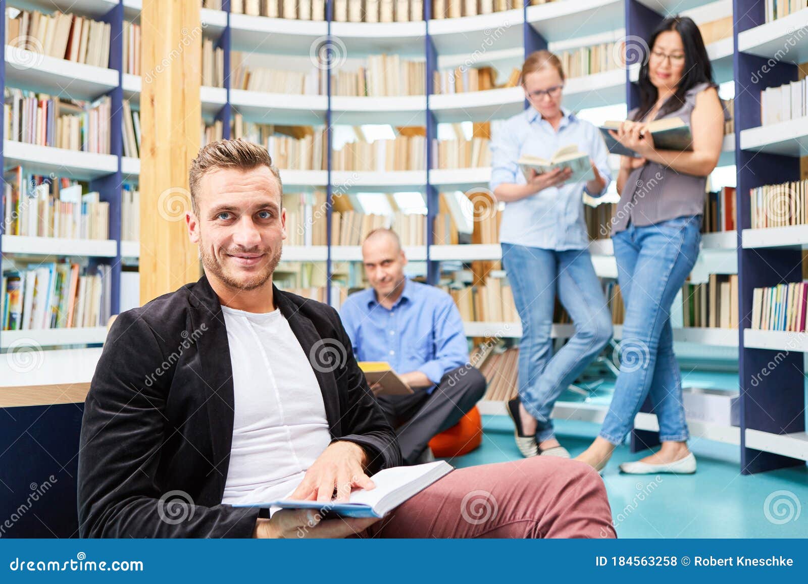 Man Reading the Book Together with Young People Stock Photo - Image of ...