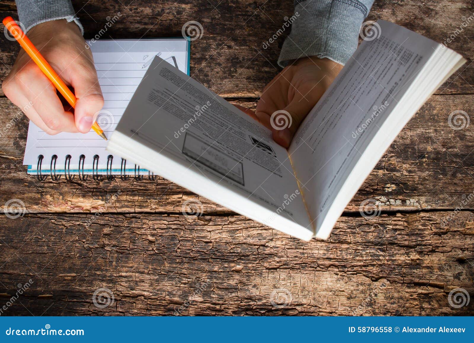 Man Reading a Book and Writes the Acquired Knowledge Stock Photo ...
