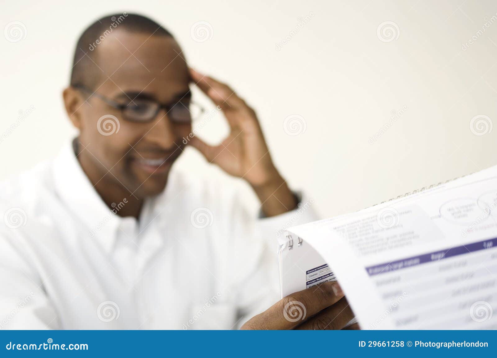 Man Reading a Document stock photo. Image of happiness - 29661258