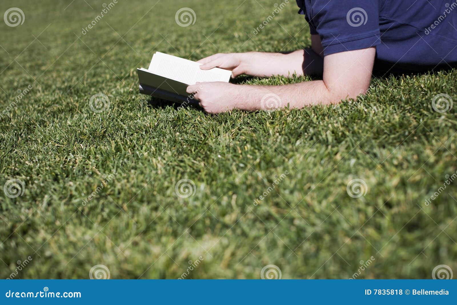 Man reading on grass stock photo. Image of smile, youth - 7835818