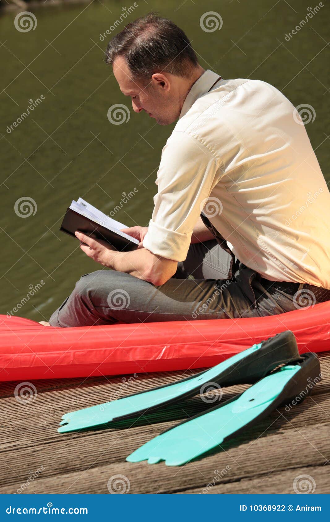 Man reading his notes stock photo. Image of resting, outdoor - 10368922