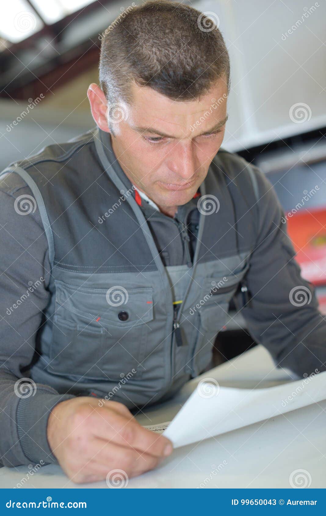 Man Reading Important Paper in Workshop Stock Image - Image of outdoor ...