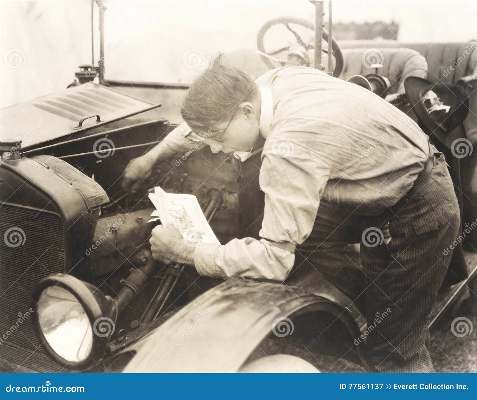 Man Reading Instructions on How To Fix Car Stock Image - Image of food ...