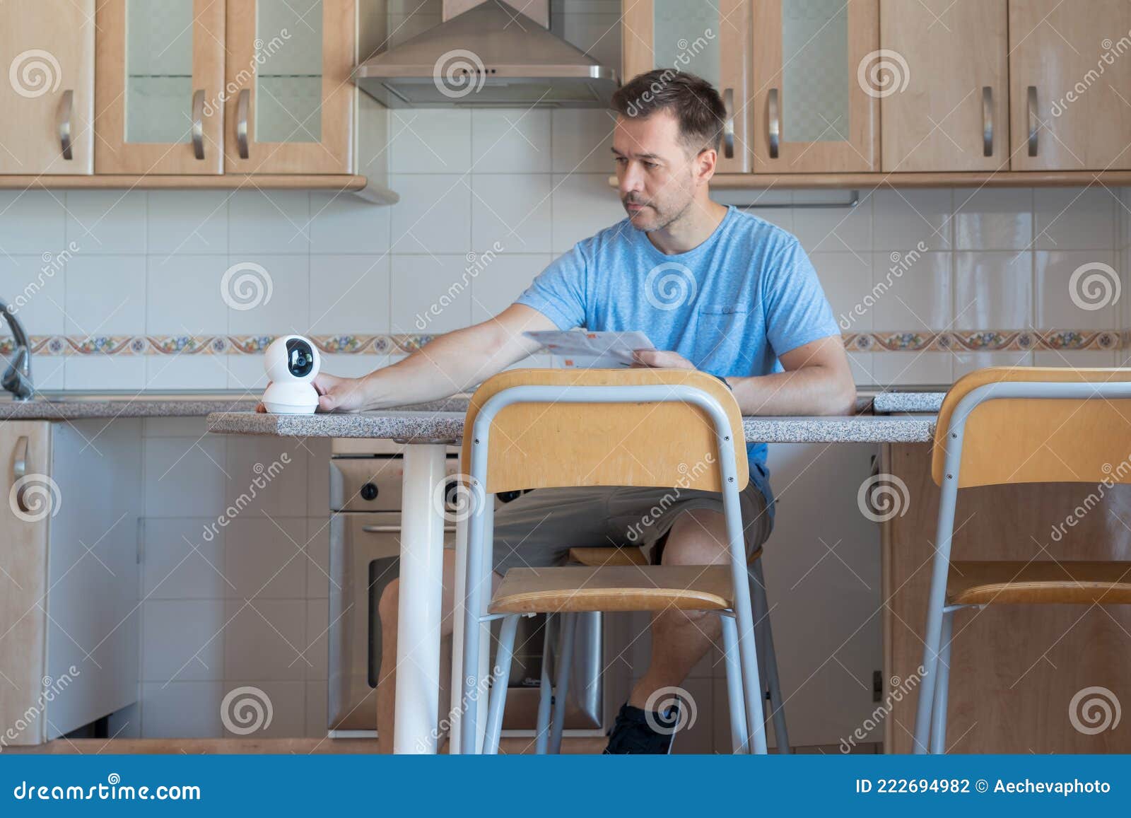 Man Reading the Instructions for Installing a Security Camera Stock ...