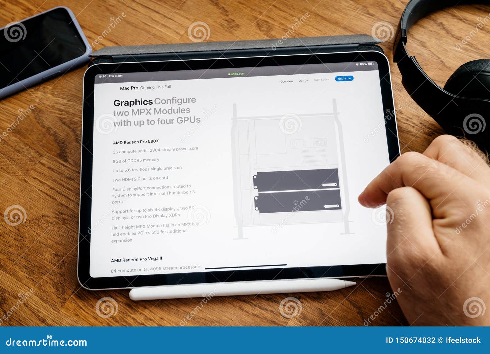 Man Reading on IPad Pro Launch Mac Pro Workstation GPu Modules ...