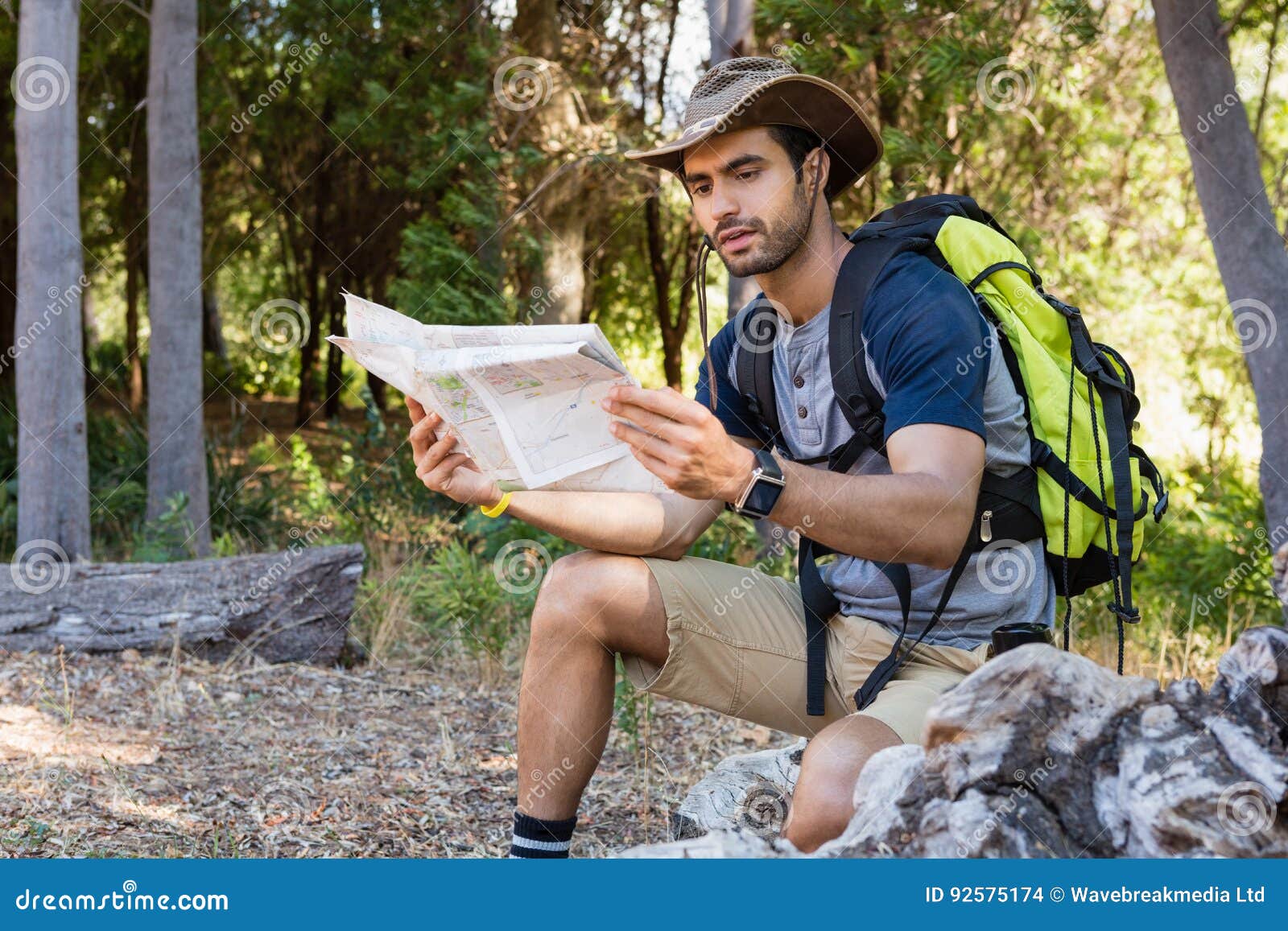 Man Reading the Map while Resting in the Forest Stock Photo - Image of ...