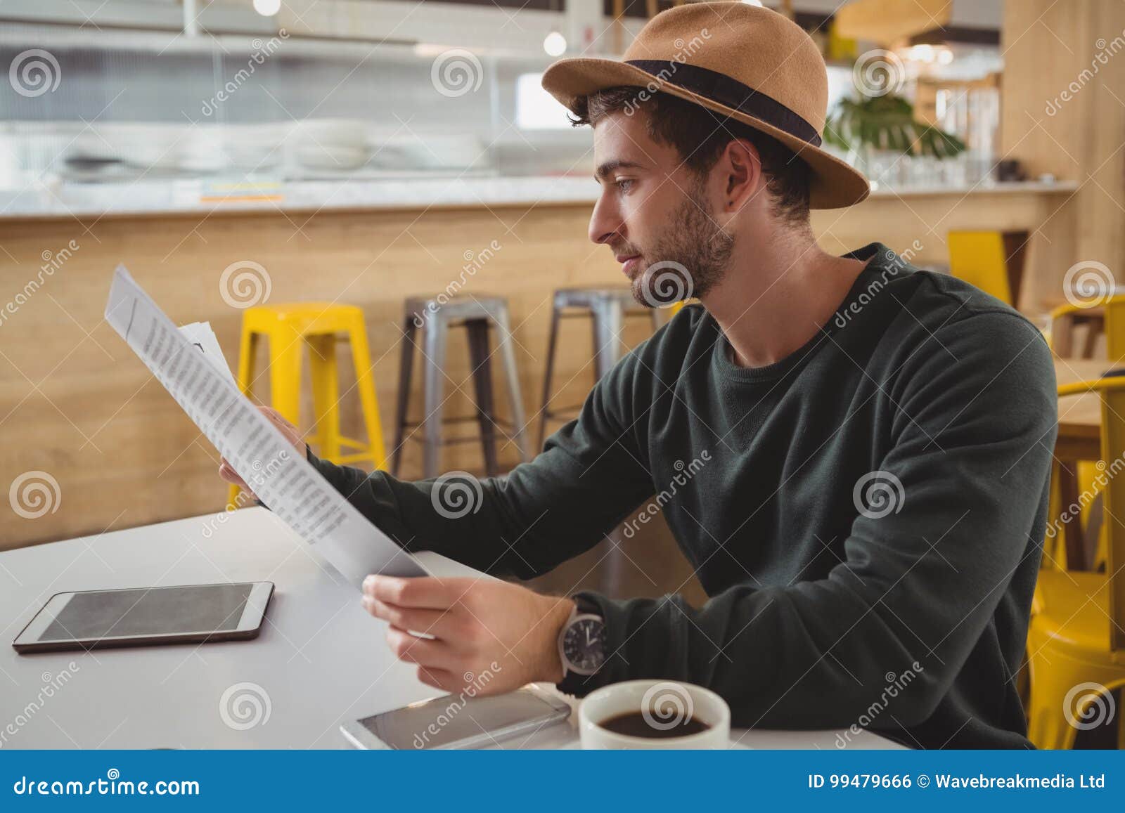 Man reading menu at cafe stock photo. Image of stubble - 99479666