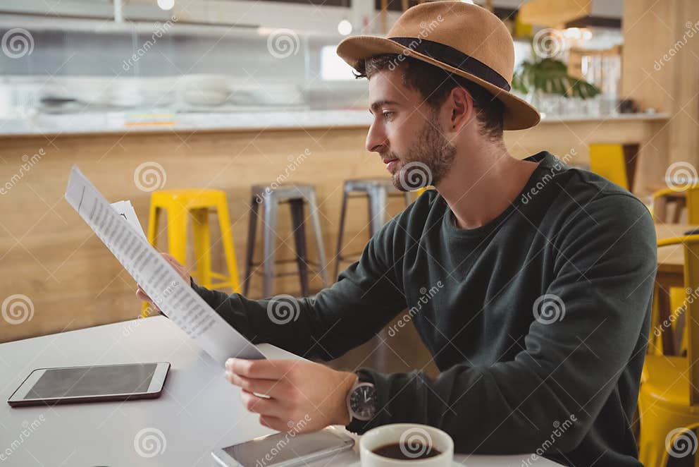 Man reading menu at cafe stock photo. Image of stubble - 99479666