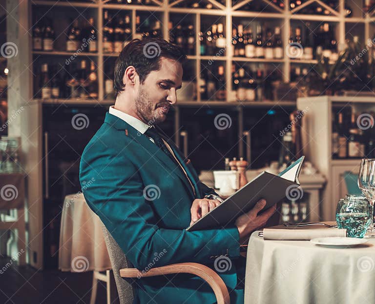 Man Reading Menu in a Restaurant Stock Image - Image of lady ...
